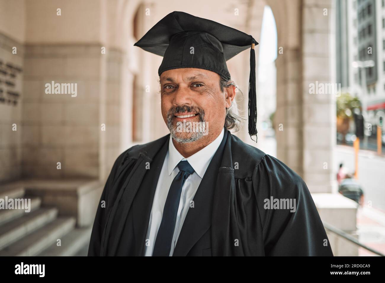 Senior man, graduate of law and smile in portrait outdoor, academic achievement and education in ...
