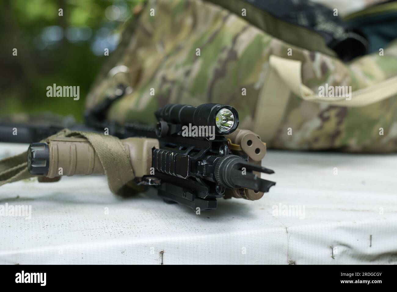 airsoft weapon hk416, black weapon on the table with a flashlight Stock ...