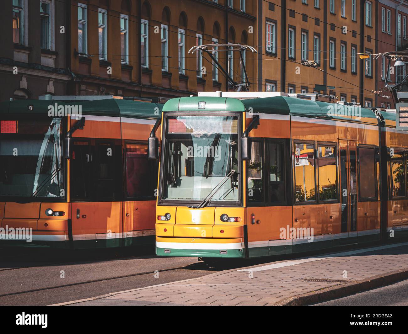 two trams in the city during day Stock Photo - Alamy