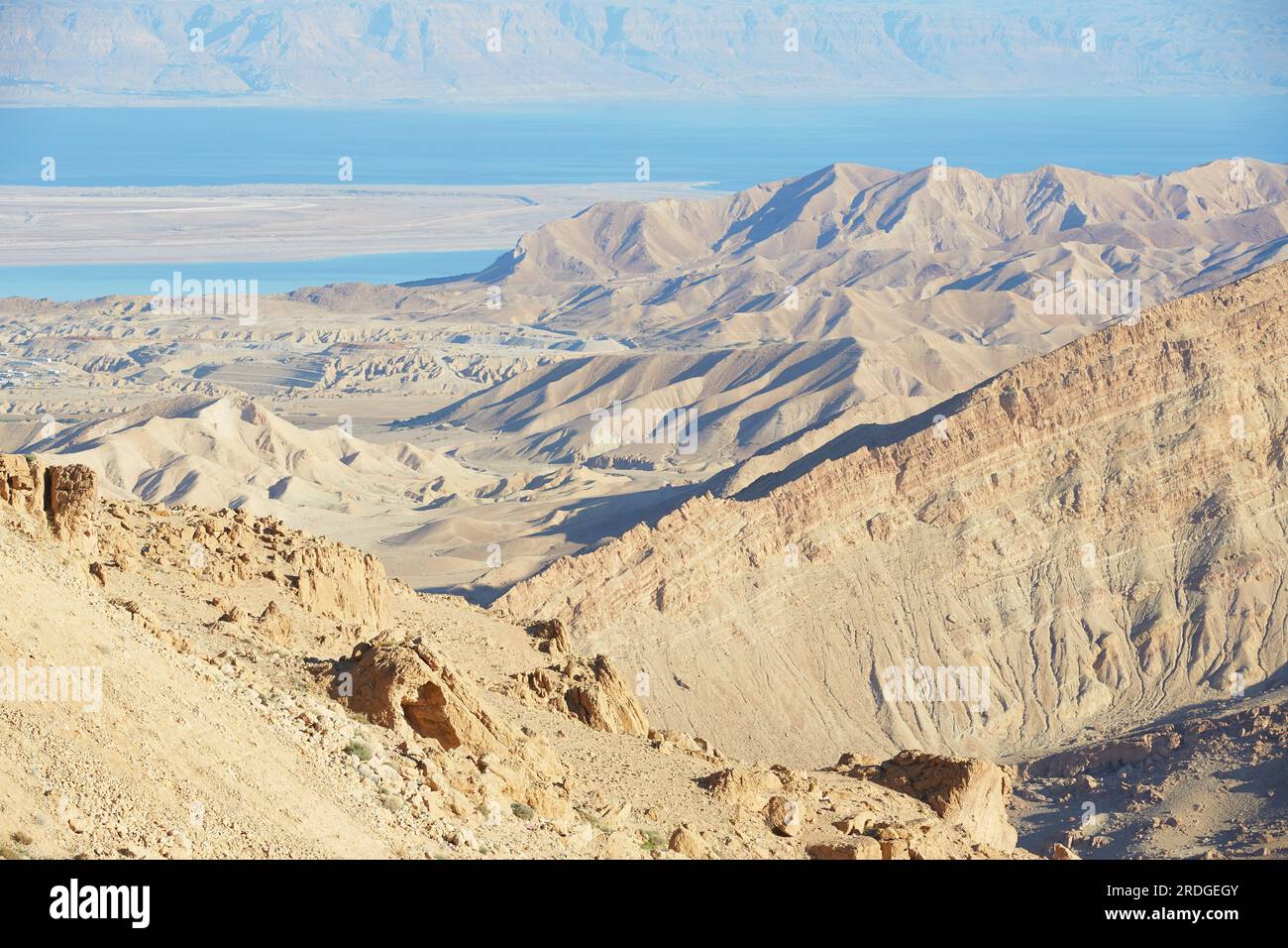 Barren landscape around The Dead Sea, the West Bank in the distance ...