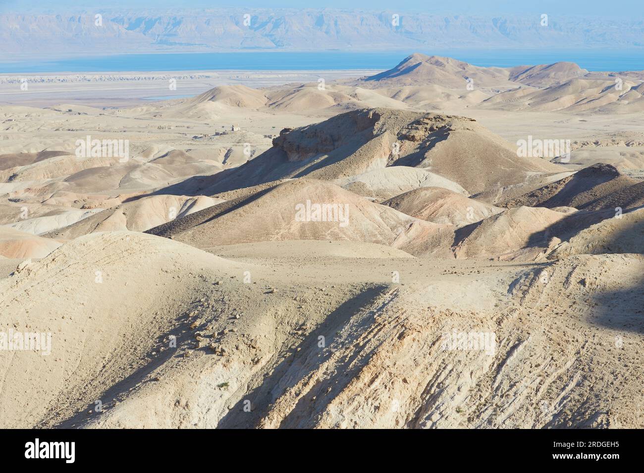 Barren landscape around The Dead Sea, the West Bank in the distance ...