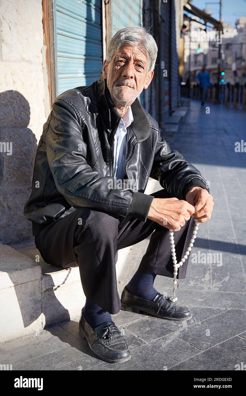 Man angel holding prayer beads in mand hands, Amman, Jordan Stock Photo ...
