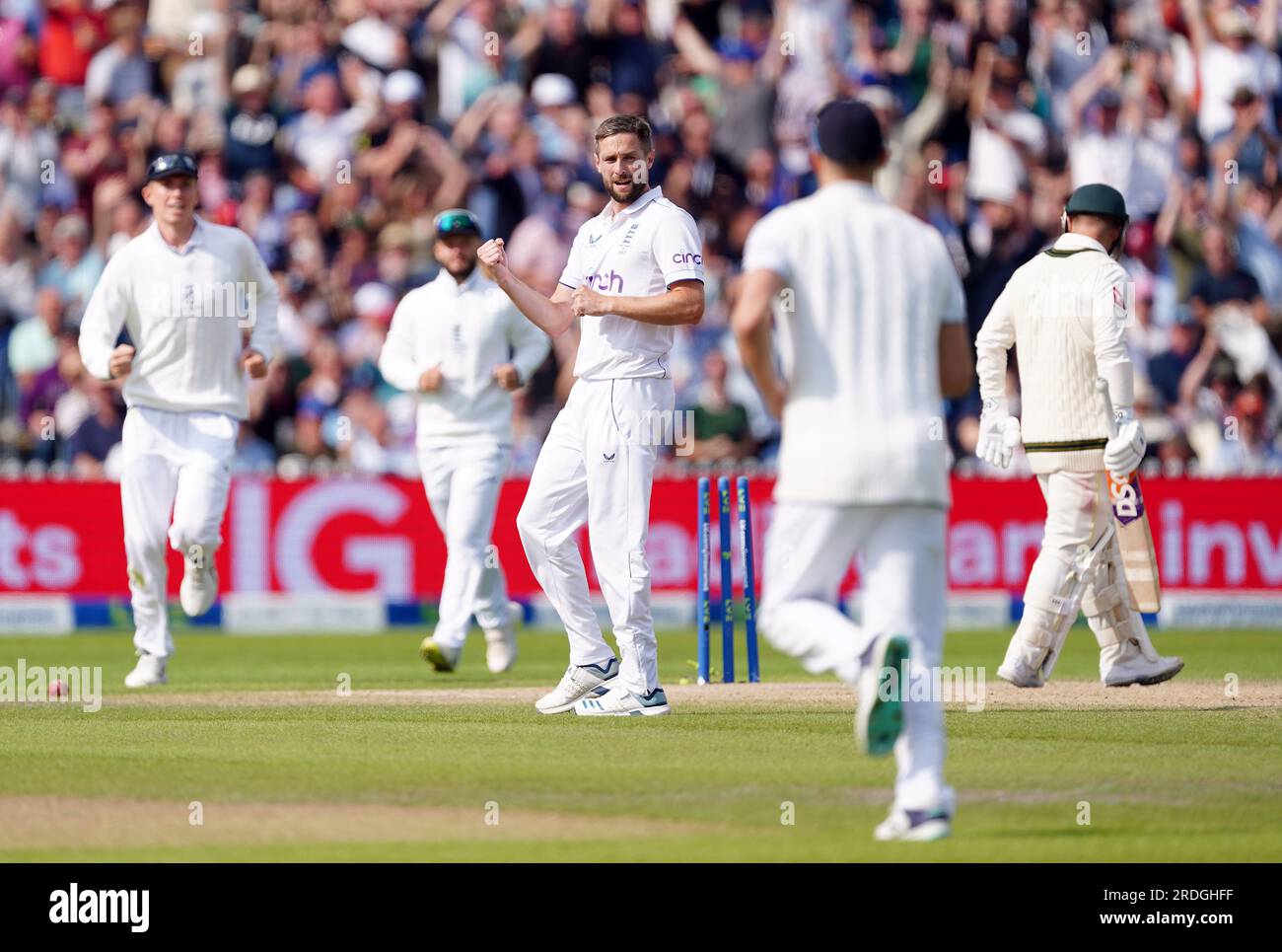 England's Chris Woakes celebrates taking the wicket of Australia's ...