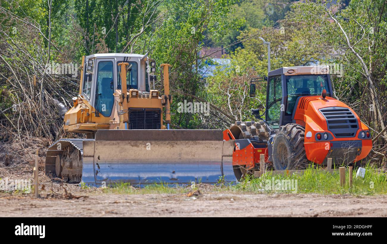 Bulldozer Earth Mover Roller Compactor Machinery at Construction Site ...