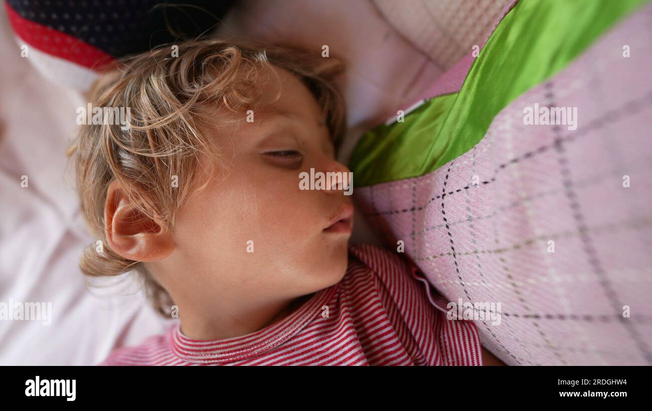Peaceful little boy sleeping face closeup child asleep napping Stock ...