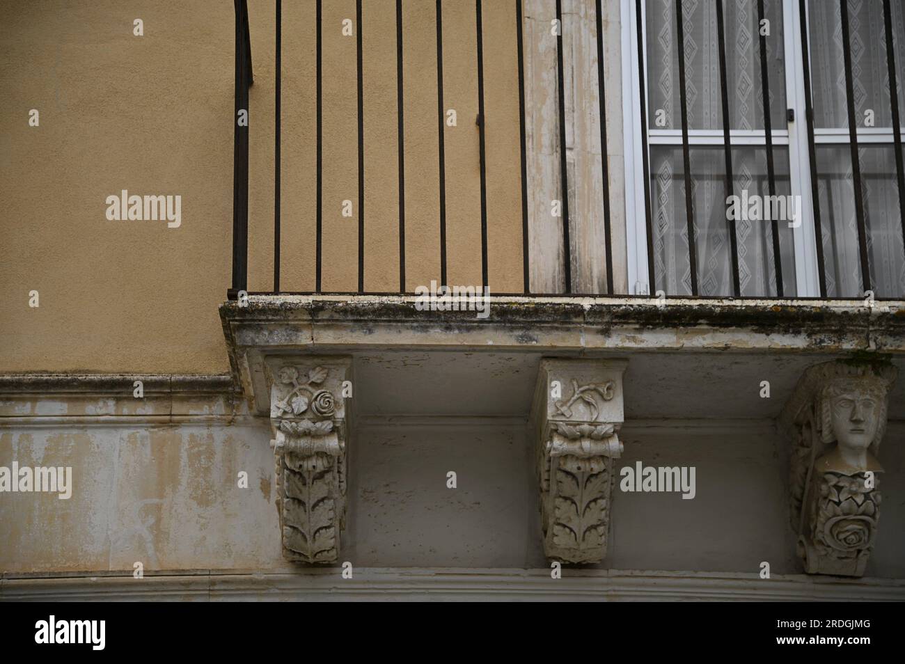 Old Neoclassical style balcony with marble sculpted balcony supports in ...