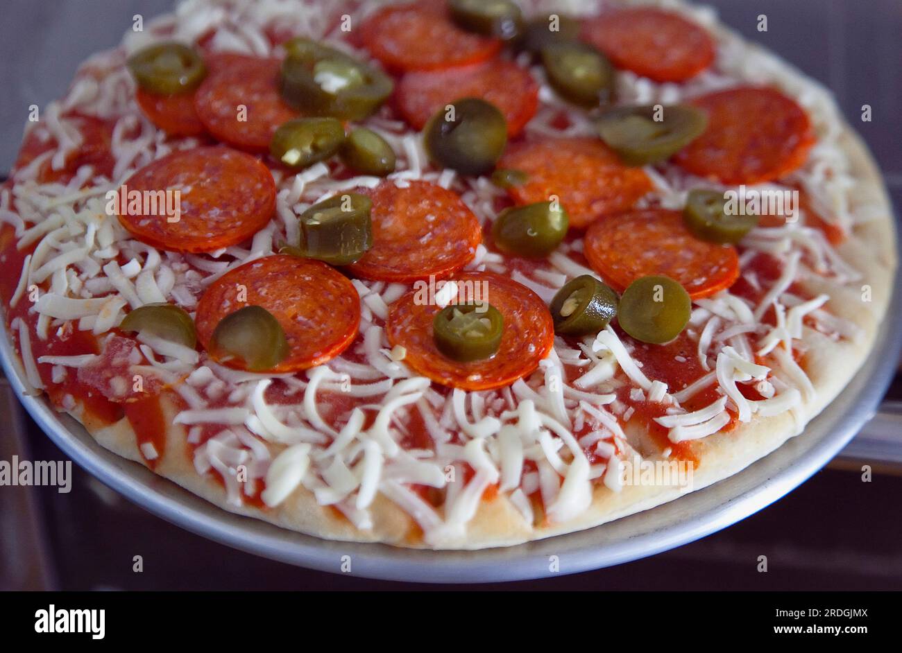 Food, Cooked, Pizza, Frozen pepperoni and jalapeno pizza on metal tray ...