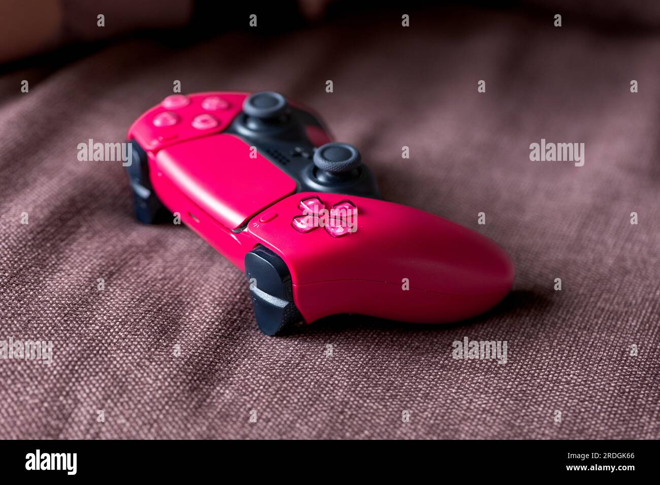 Brecht, Belgium - 14 july 2023: A portrait of an cosmic red playstation ...