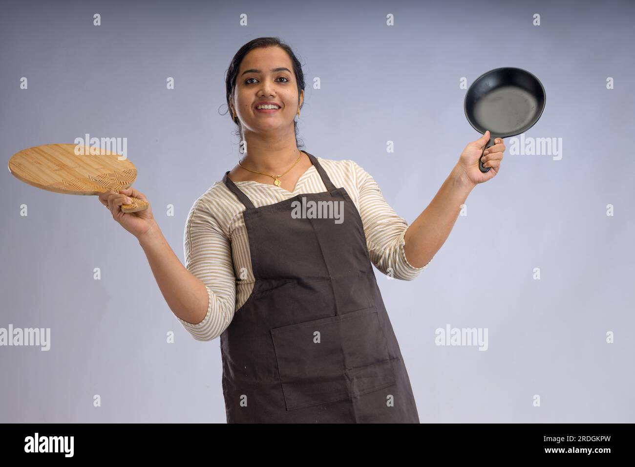 Indian lady cooking hi-res stock photography and images - Alamy