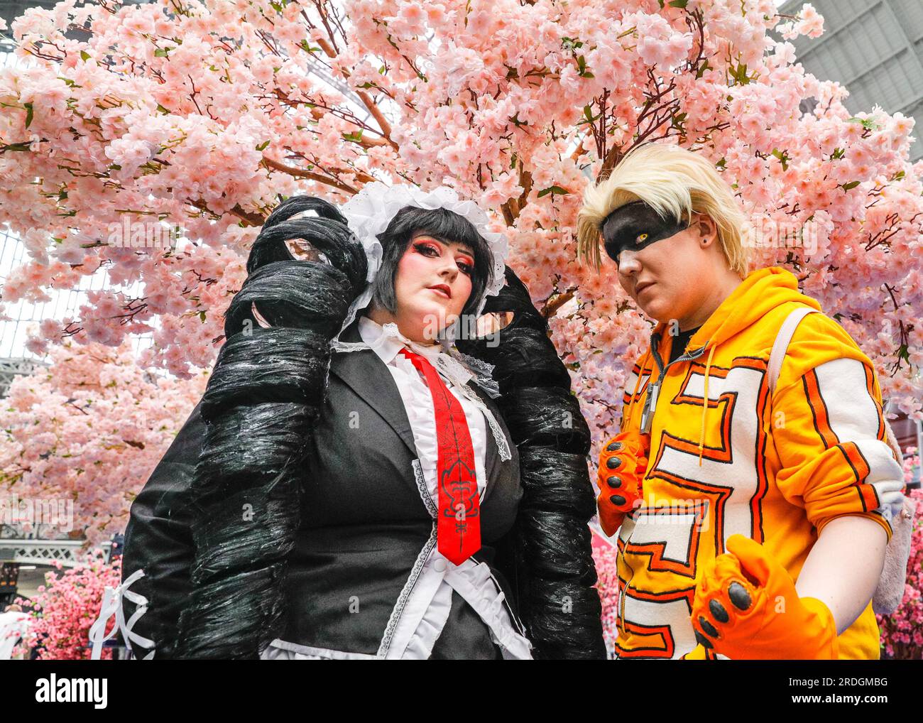 London, UK. 21st July, 2023. Two visitors in cosplay outfits pose with ...