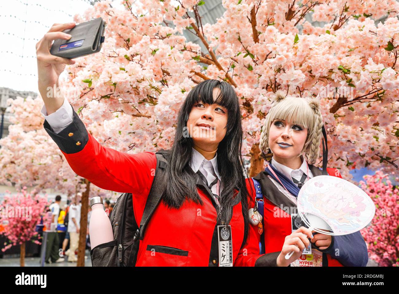 London, UK. 21st July, 2023. Two visitors in cosplay outfits pose with ...