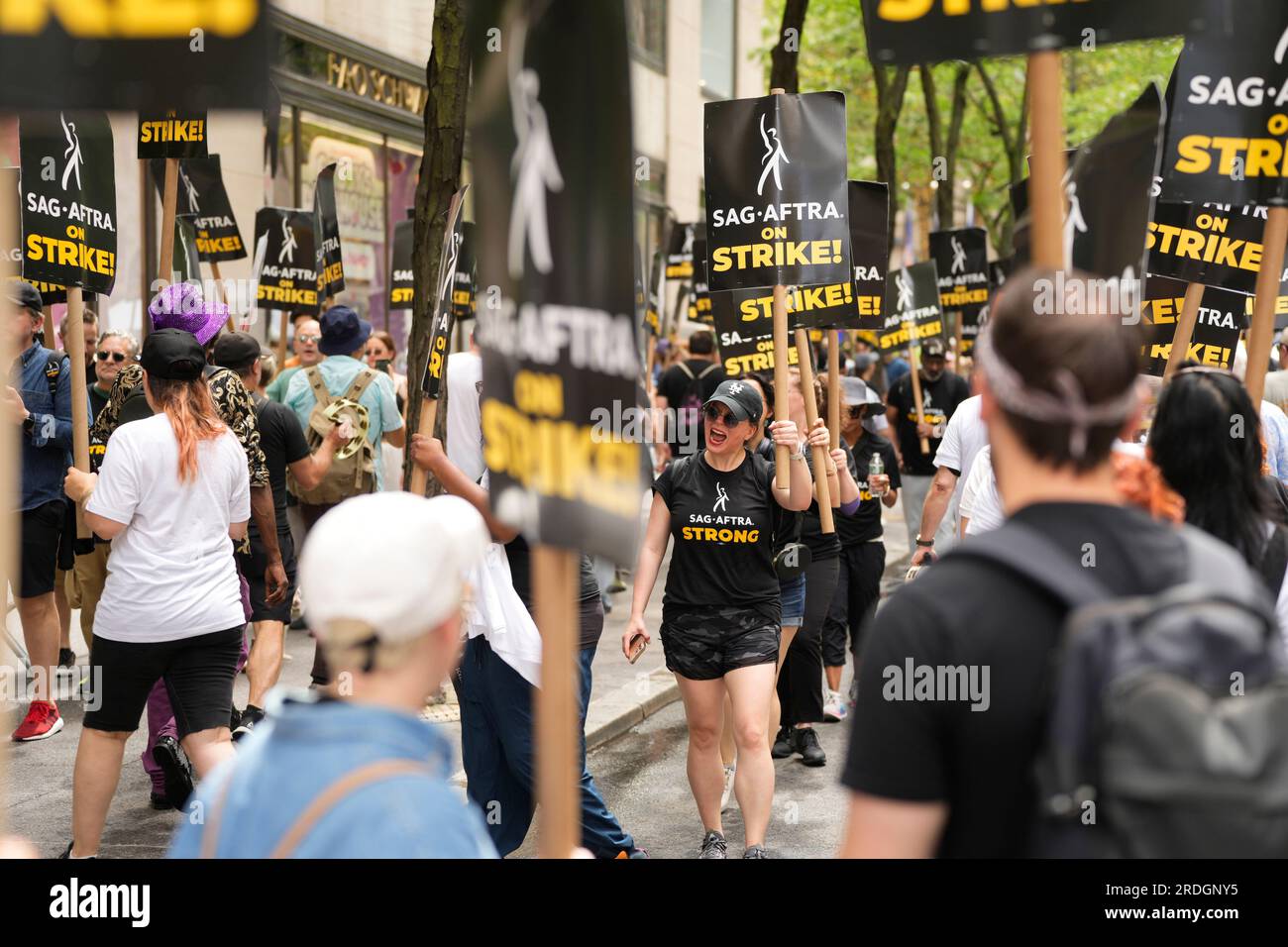 Picketers carry signs outside NBC in Rockefeller Center on Friday, July ...