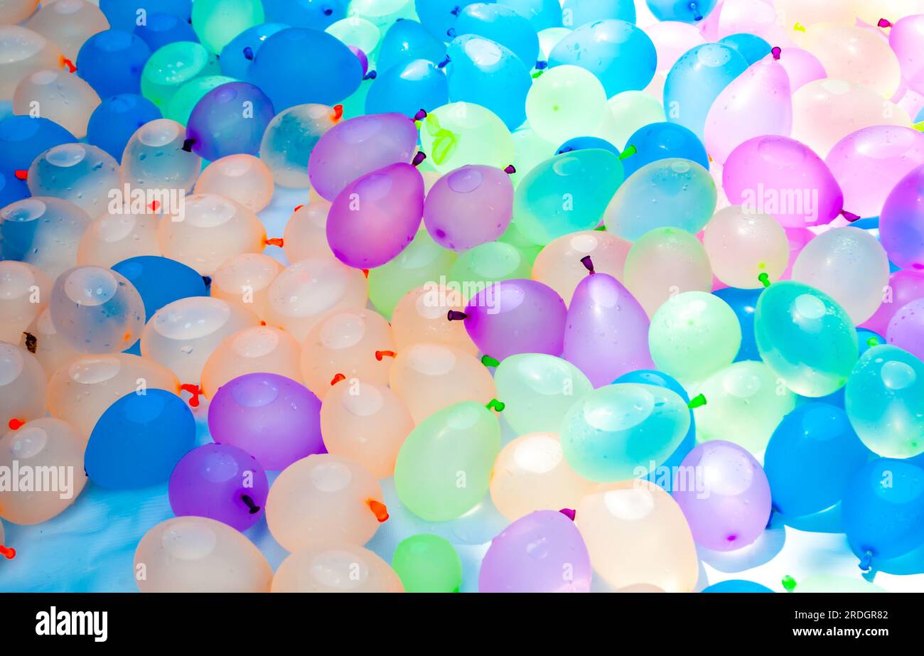 Multi-colored balloons filled with water prepared for the water game of ...