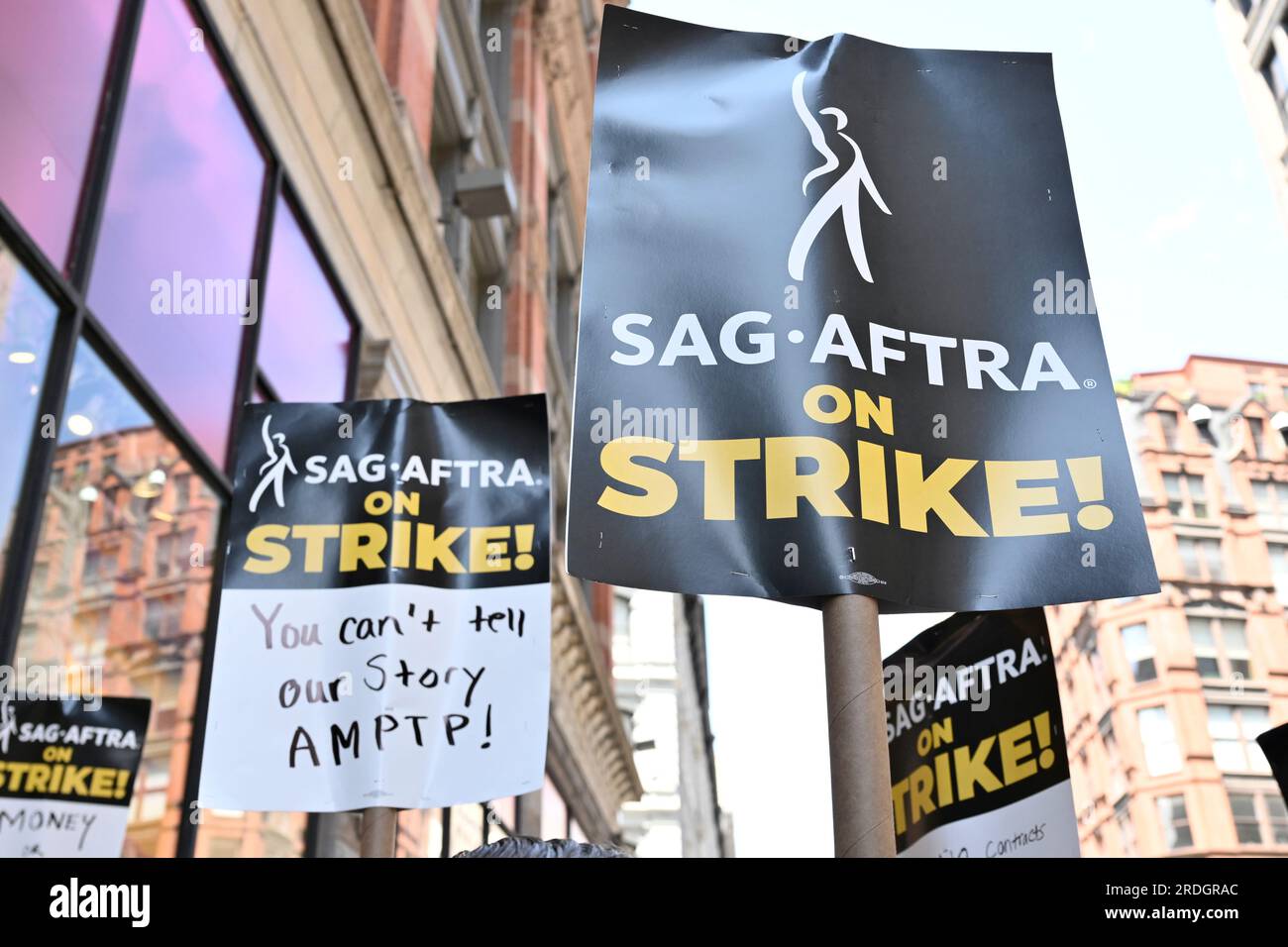 Picketers carry signs outside Netflix on Friday, July 21, 2023, in New ...