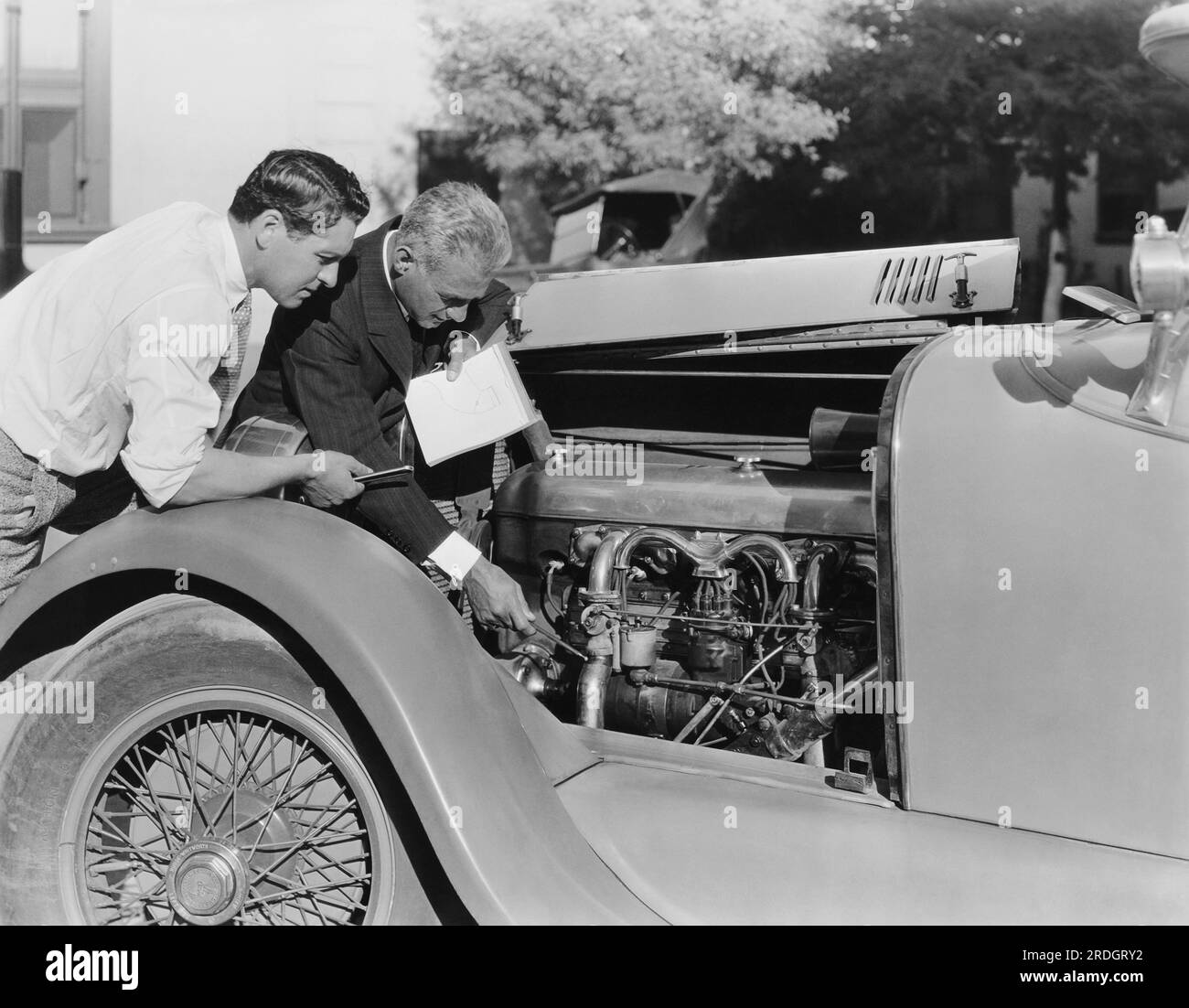 Hollywood, California: c. 1922 Actor john Bowers gets some tips on his ...