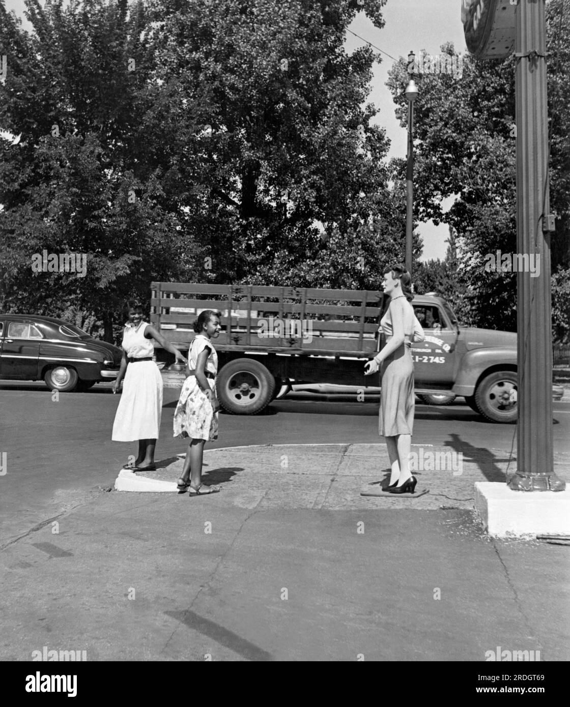 Pittsburgh, Pennsylvania: August 16.1954 Two pedestrians are caught by ...