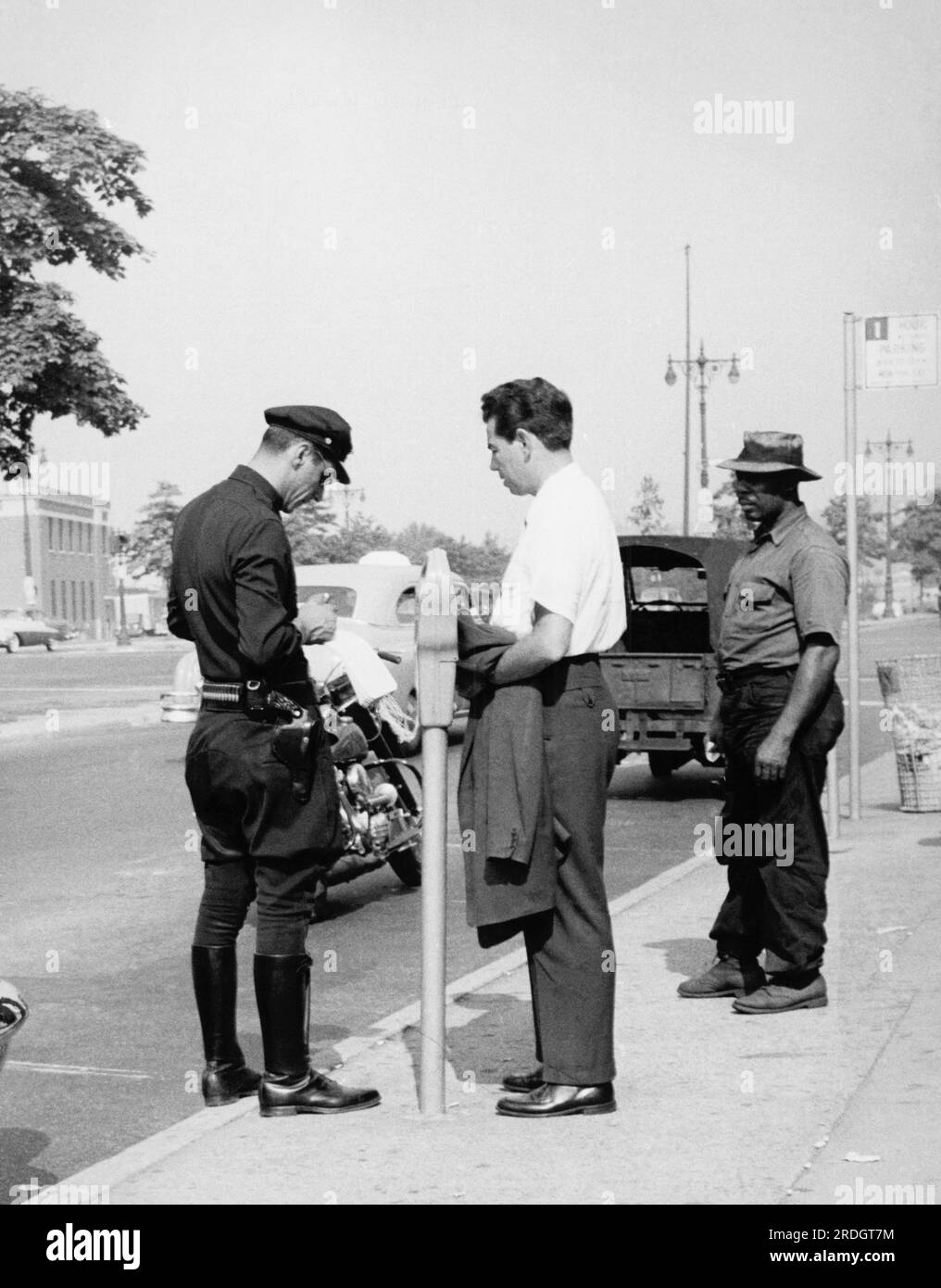 United States: 1955. A man gets a parking ticket for an expired meter ...