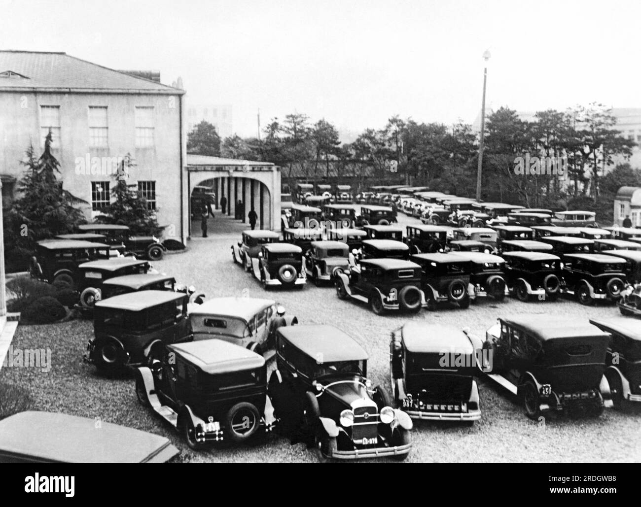 Tokyo, Japan: c. 1928 American cars in the parking lot used by the ...