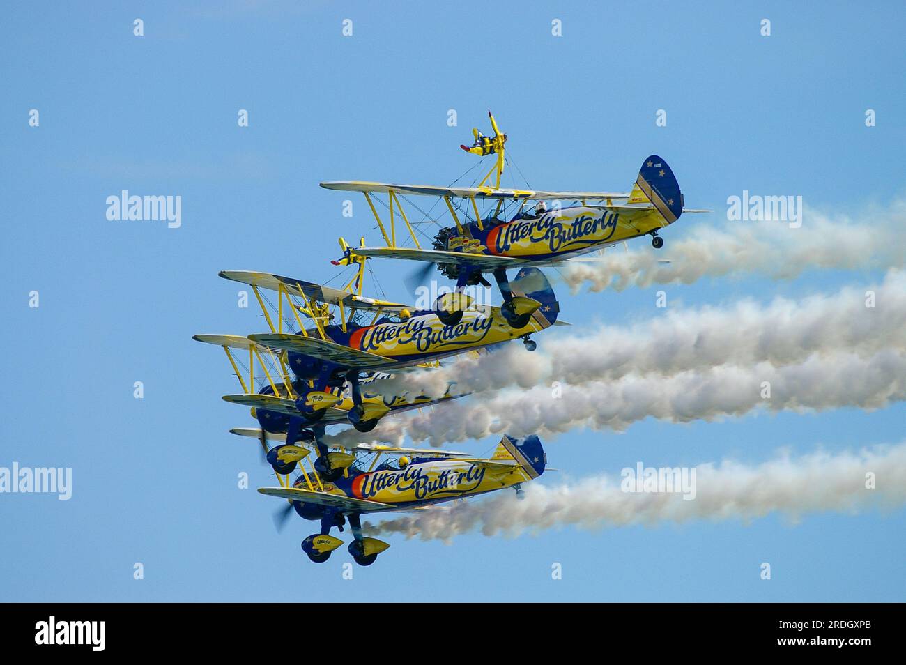 Aerosuperbatics Utterly Butterly wingwalkers display team flying in ...