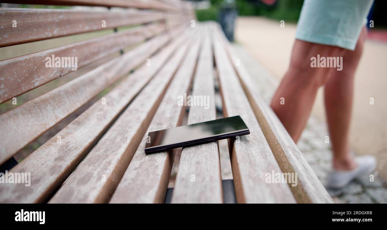 Lost Personal Phone. Woman Leaves Smartphone On Bench Stock Photo - Alamy