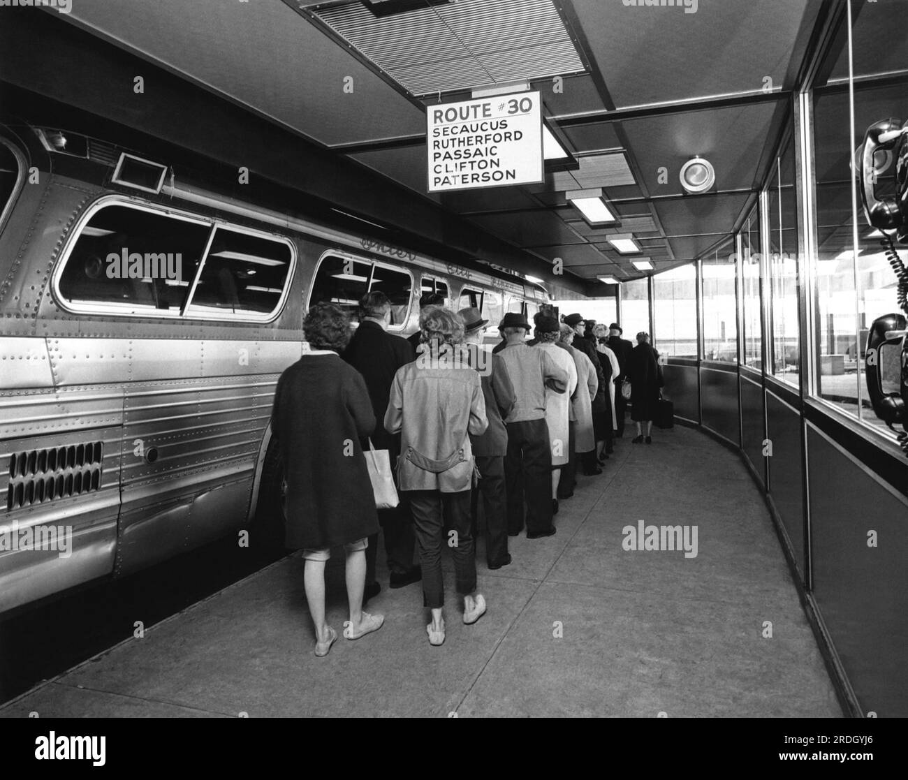 New York, New York: May 1, 1963 Passengers in line to board the Route ...