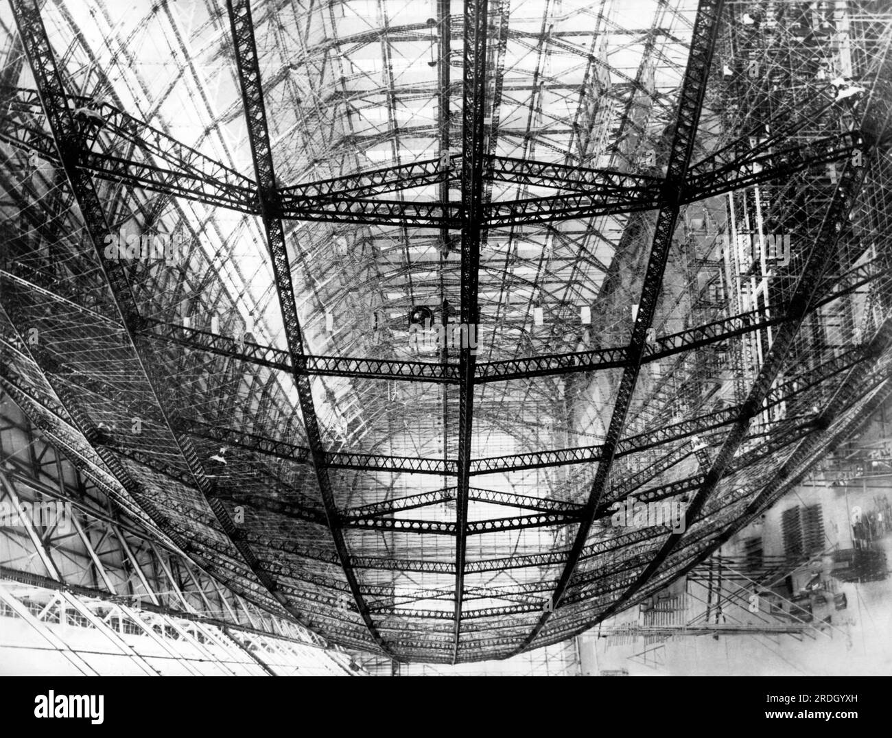 Friedrichshafen, Germany: c. 1933. The frame of the LZ 129 is taking ...