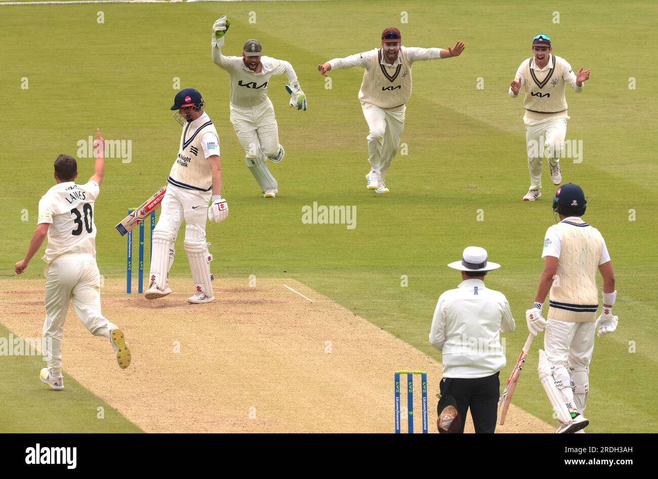 London, UK. 21st July, 2023. Surrey's Tom Lawes gets John Simpson as ...
