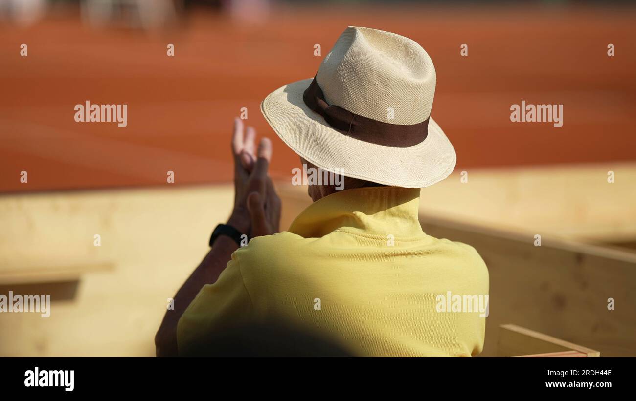 Spectator watching tennis match game clapping hands cheering from ...