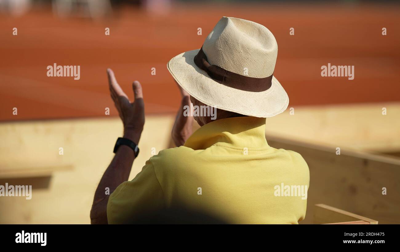 Spectator watching tennis match game clapping hands cheering from ...