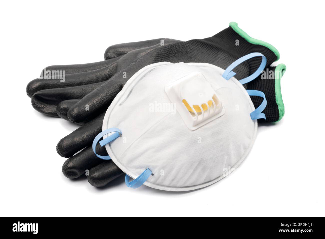 Dust mask and work gloves with rubber isolated on white. Personal ...