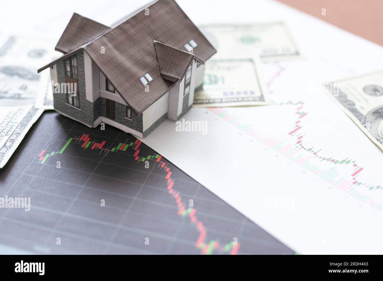 Housing market concept image with graph and toy house Stock Photo - Alamy