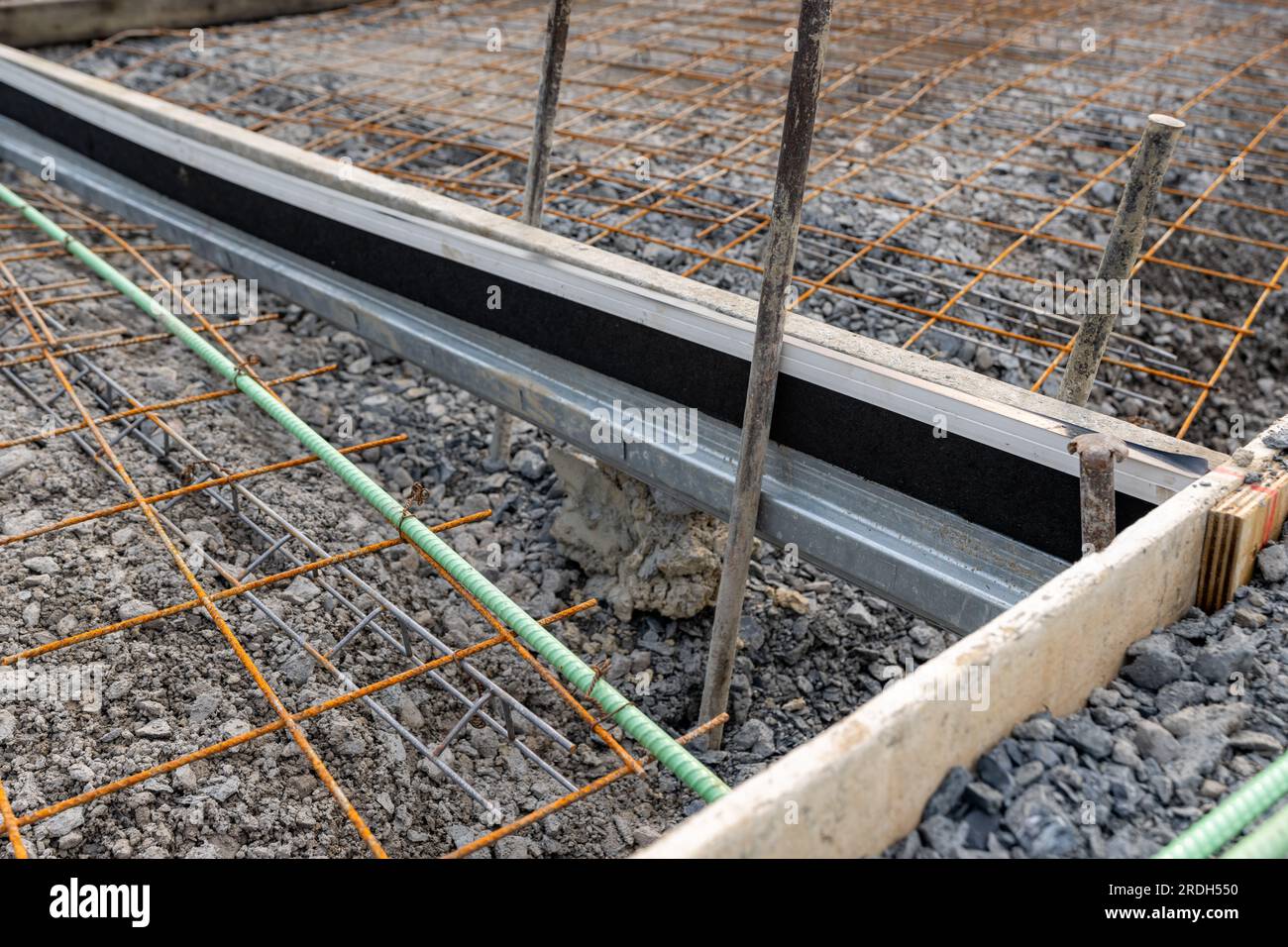 Welded wire mesh, WWM, installed within a sidewalk concrete form prior ...