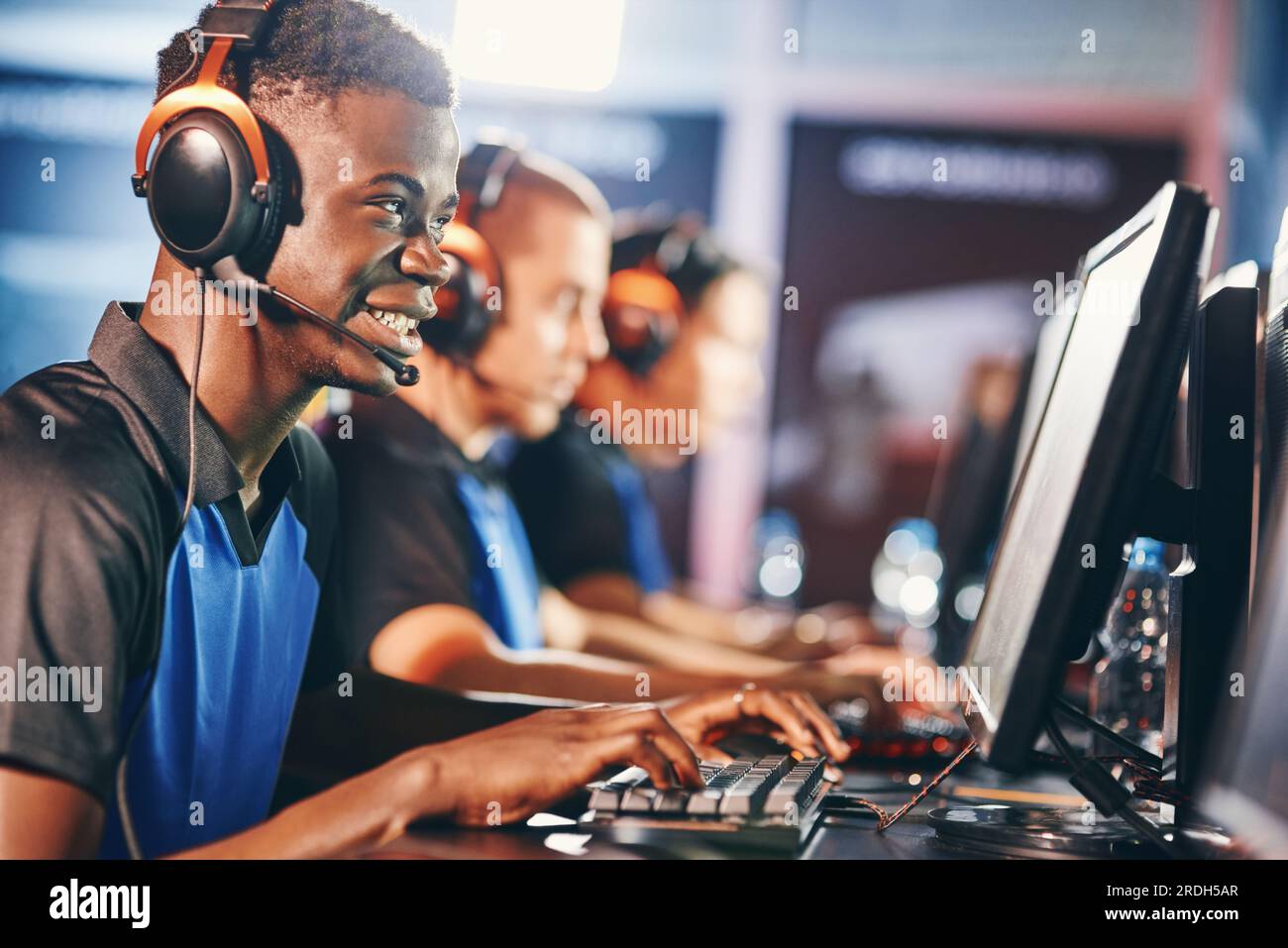 Side view of a young excited african guy, male cybersport gamer wearing ...