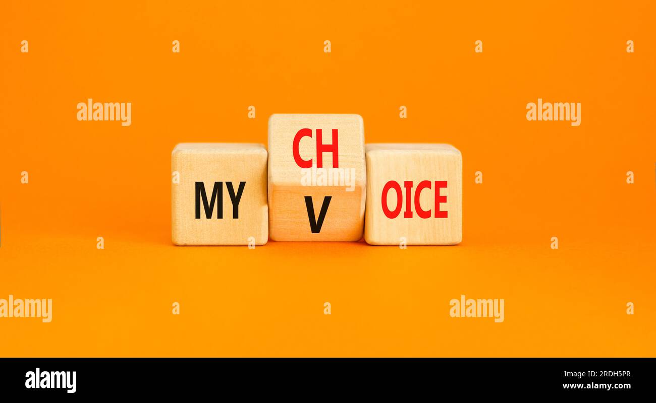 My voice and choice symbol. Businessman turns wooden cubes and changes ...
