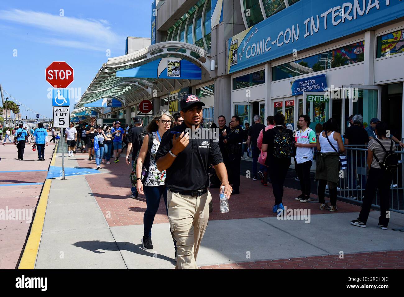 Attendees wait on line to enter the San Diego Convention Center for ...