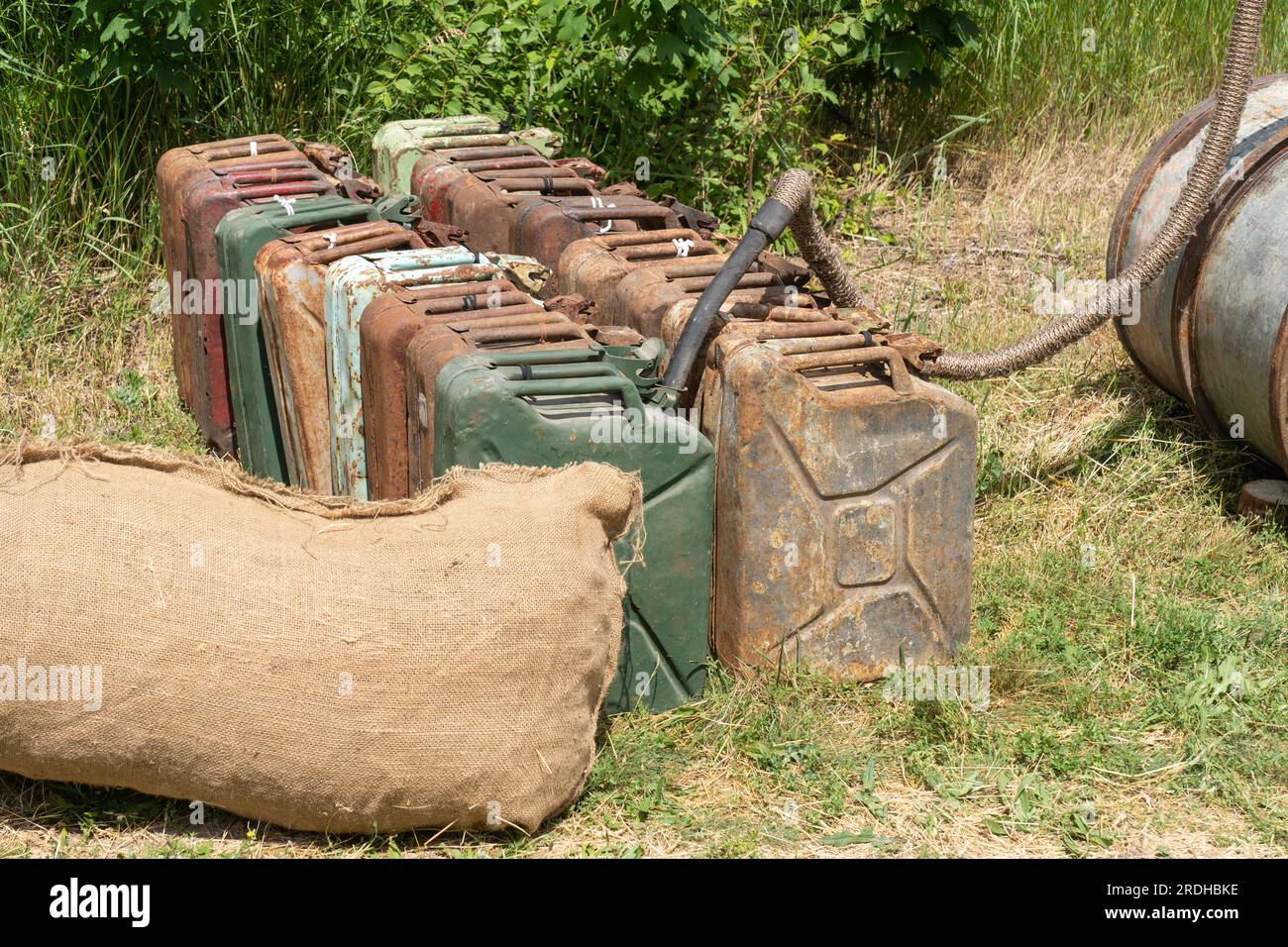 Old rusty WWII petrol cans outdoors Stock Photo - Alamy