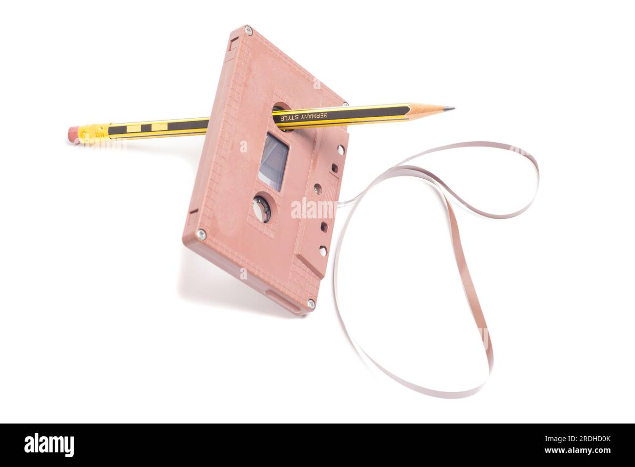 Audio cassette tape with pencil isolated on white background, vintage ...