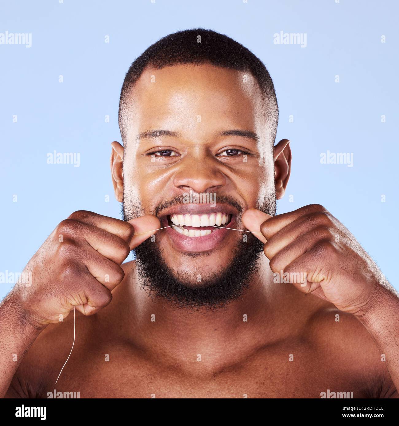 Portrait, black man and floss teeth in studio, healthy dental care or gum gingivitis. Face of ...