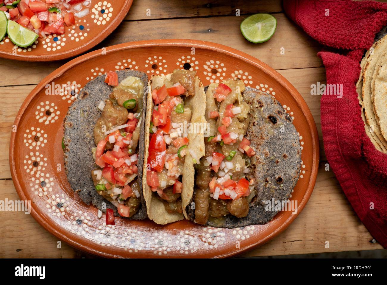 Chicharrones in a green sauce tacos served with pico de gallo salad ...