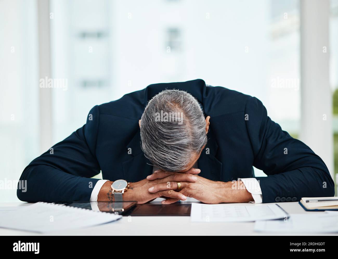 Burnout, professional and senior man sleeping at desk with tech or ...