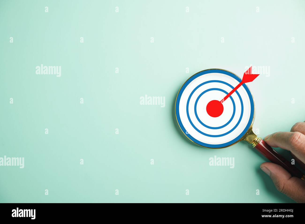 Target board inside magnifier glass for focus business objective Stock ...