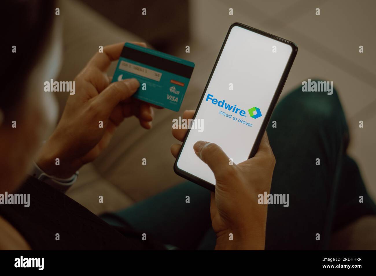 In this photo illustration, the Fedwire logo seen displayed on a ...