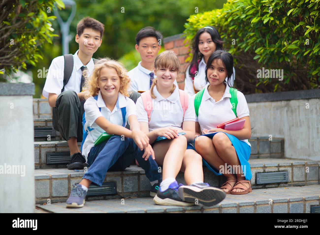 Kids go back to school. Interracial group of children of mixed age on ...