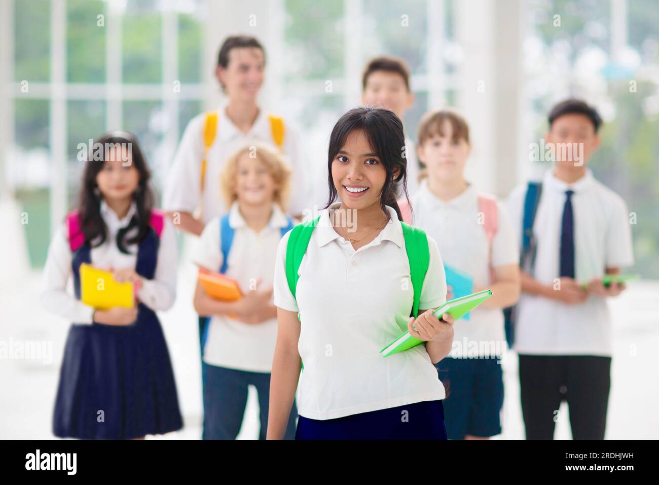 Kids go back to school. Interracial group of children of mixed age on ...