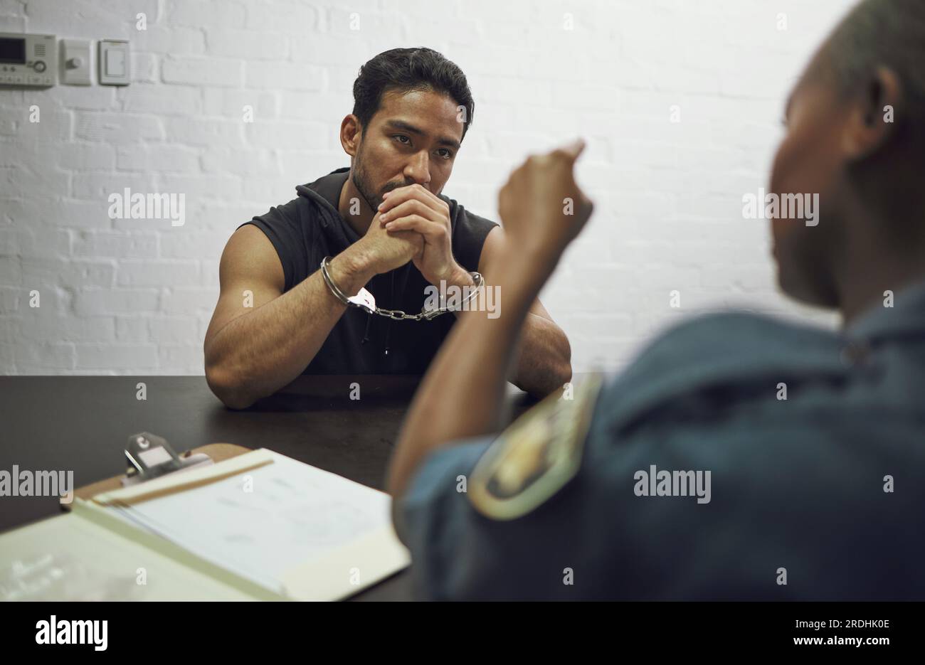 Man, criminal and handcuffs with police for interrogation, crime or ...