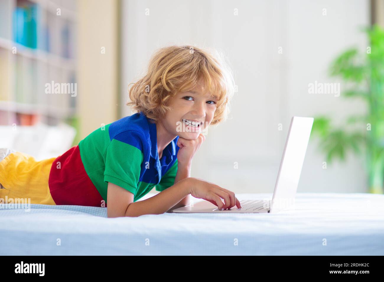 Child doing homework on computer. Online class. Homeschooling and ...