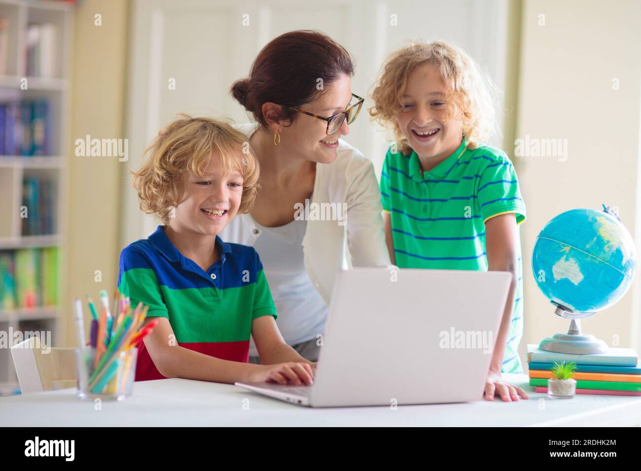 Child doing homework on computer. Online class. Homeschooling and ...