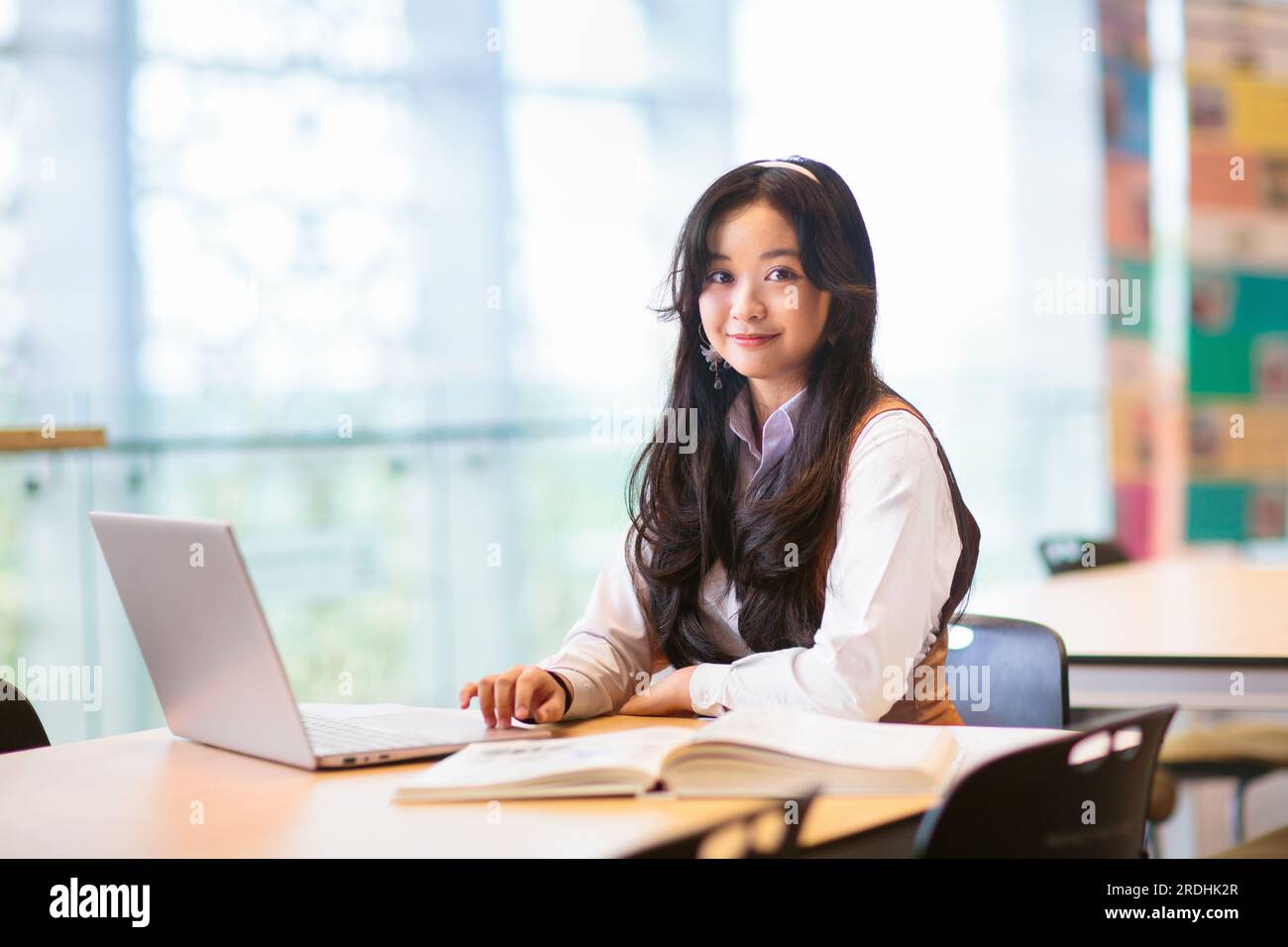 Asian girl with laptop in school. Student in classroom. Teenager in ...
