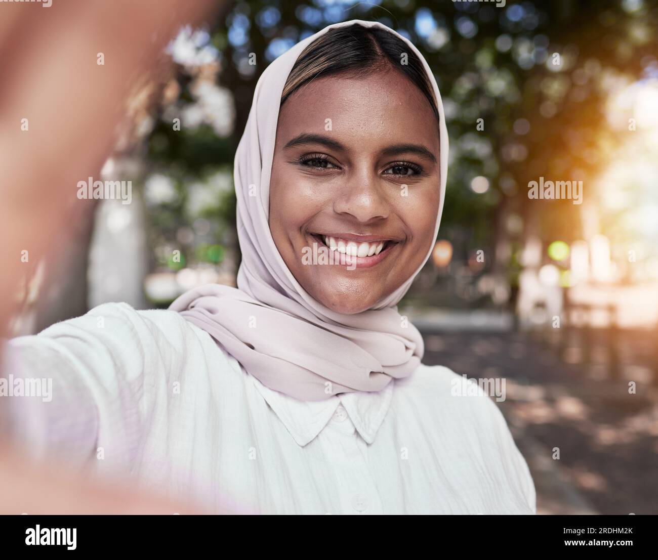 Selfie, happy and portrait of Muslim woman in park for holiday, freedom ...