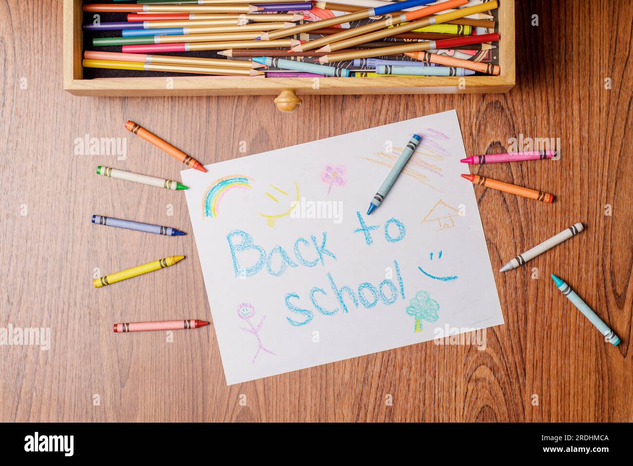 Kids drawing with crayons at a table hi-res stock photography and ...